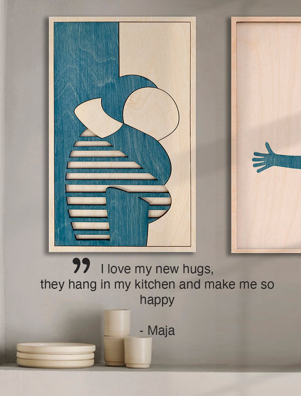 Graphic artwork of a hug cut in wood by KOLEKTO studio