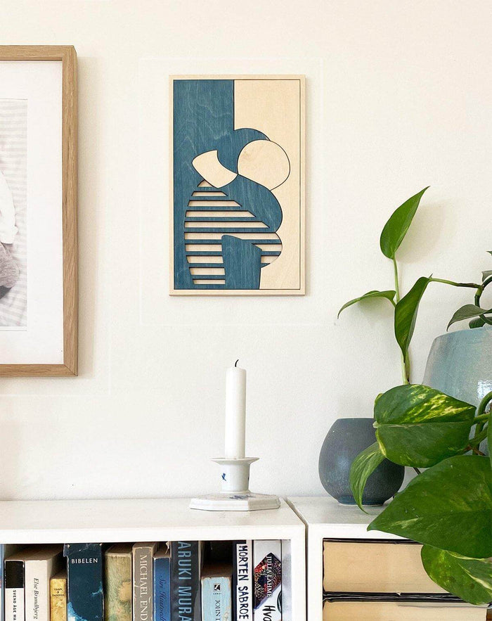 Handcrafted wooden artwork of a hug by KOLEKTO studio